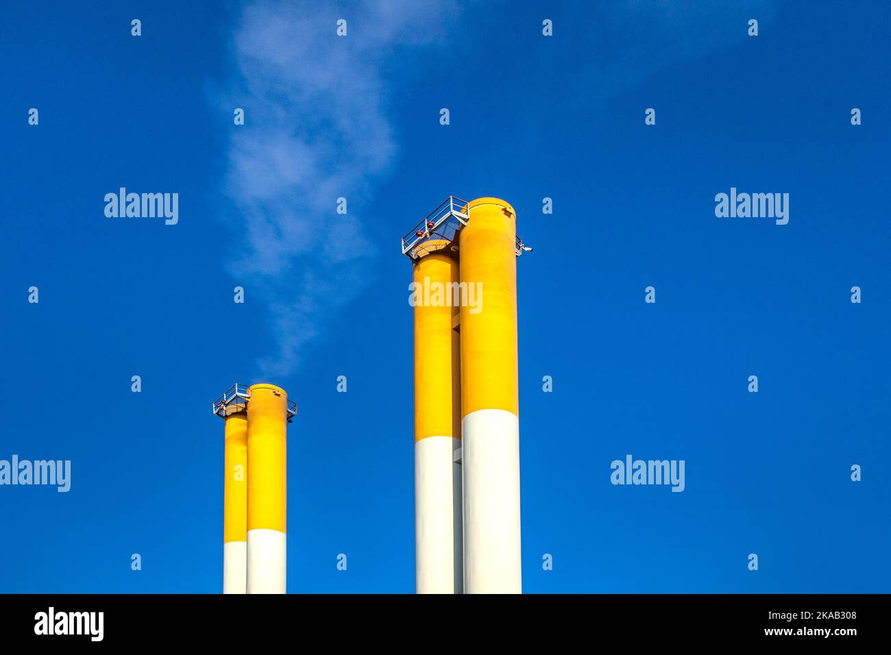 chimney with smoke and blue sky Stock Photo - Alamy
