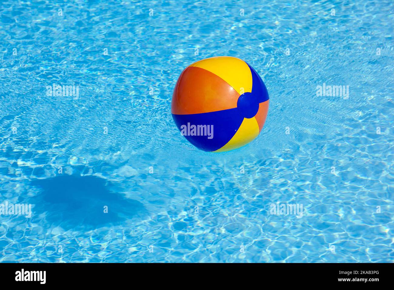inflated plastic ball flying in the pool Stock Photo - Alamy