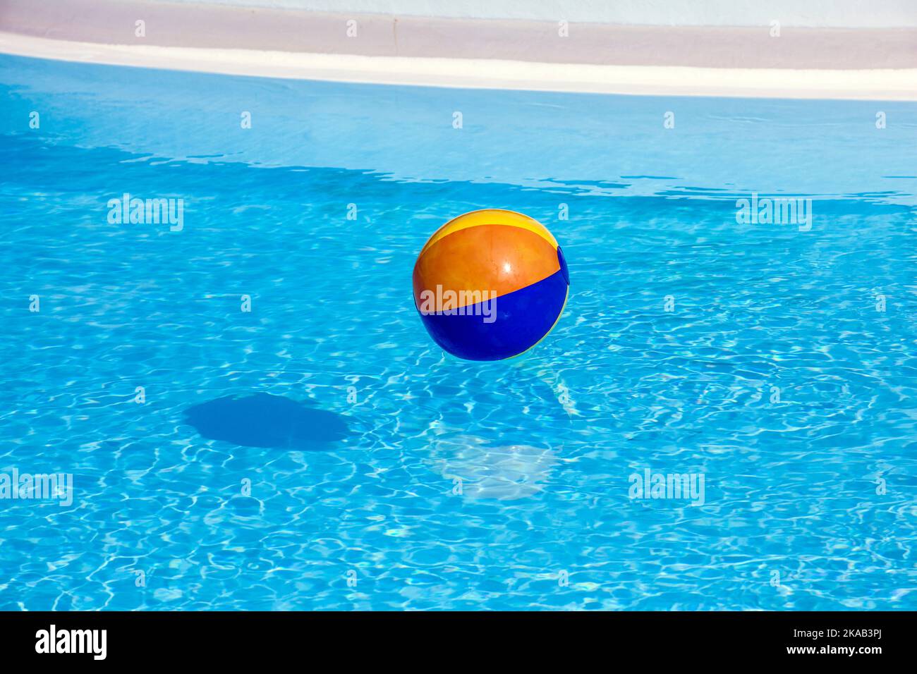 inflated plastic ball flying in the pool Stock Photo - Alamy