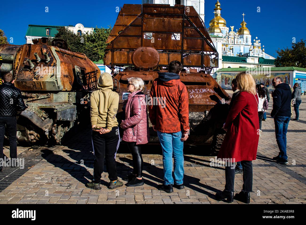 People visiting an open air exhibition and features Russian military ...