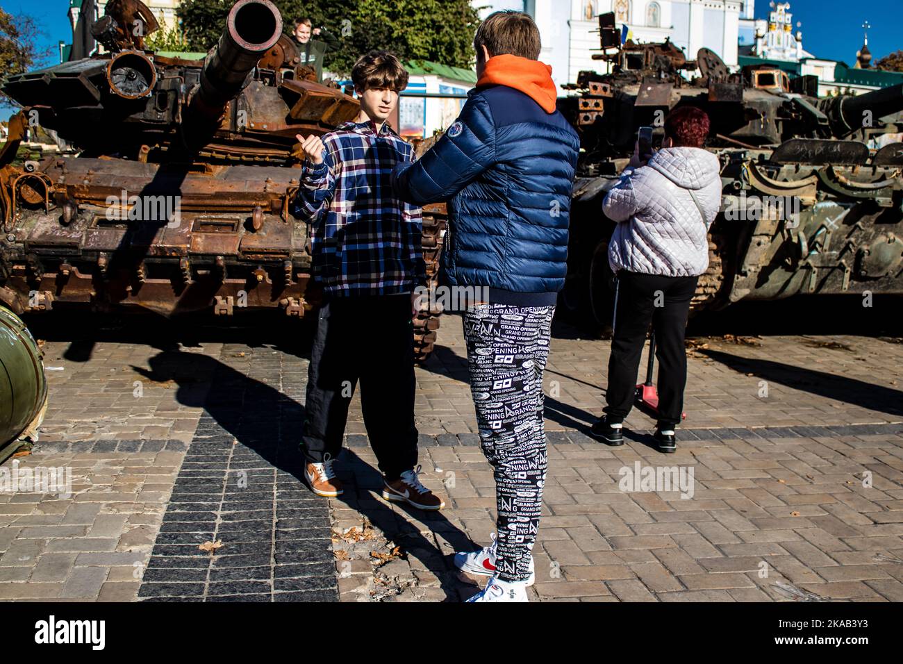 People visiting an open air exhibition and features Russian military ...