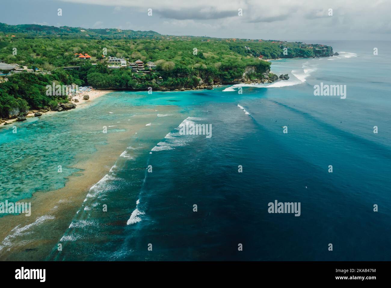 Aerial view of blue ocean with waves and coastline on Padang Padang ...