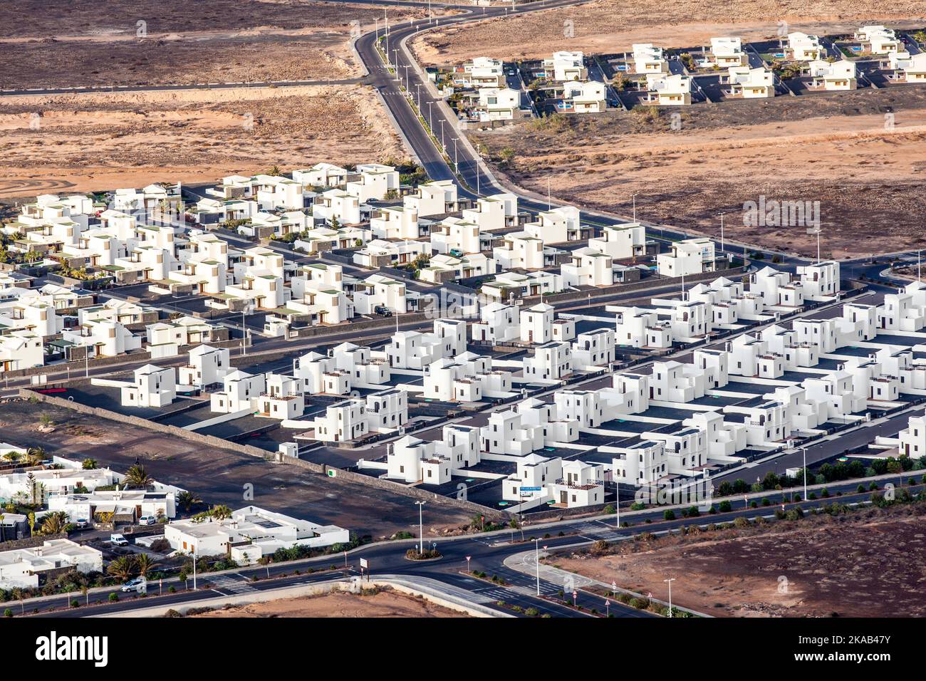 settlement of new houses all in same style Stock Photo - Alamy
