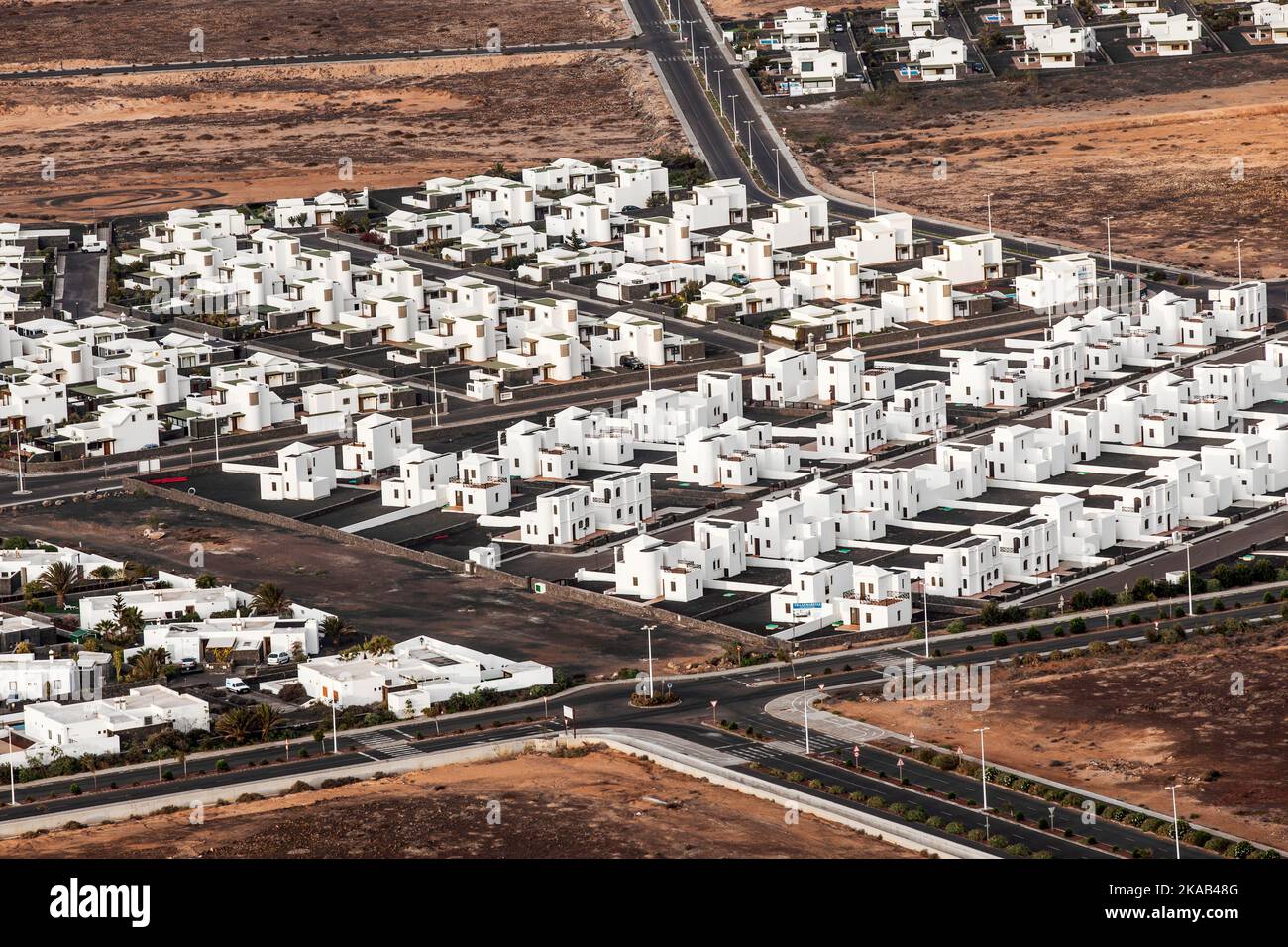 settlement of new houses all in same style Stock Photo - Alamy
