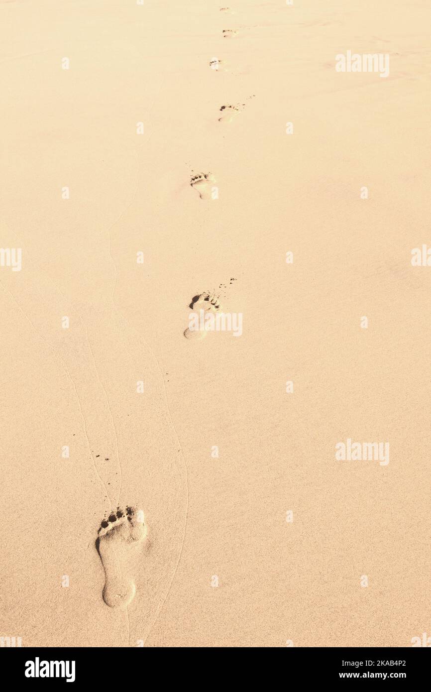 human footsteps at the clean sandy beach Stock Photo - Alamy