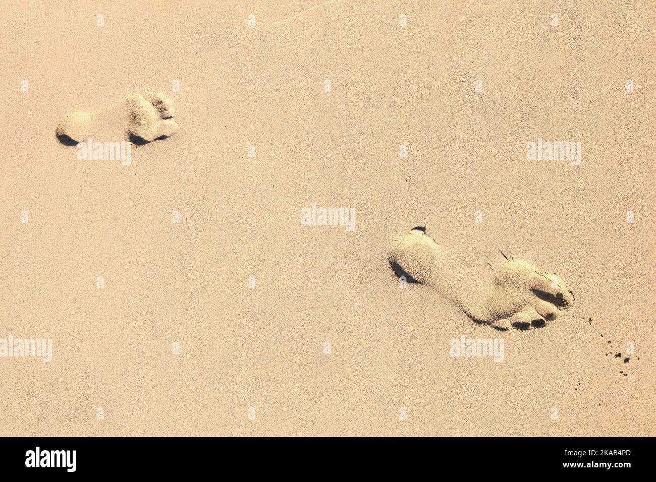 human footsteps at the clean sandy beach Stock Photo - Alamy