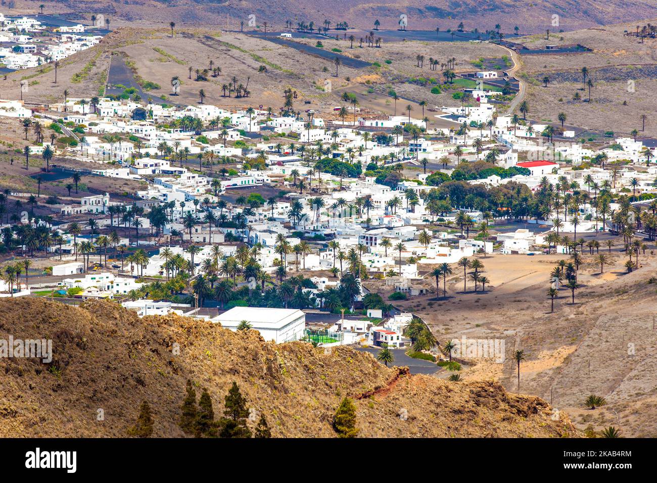 Small town of Haria in Lanzarote with palms in volcanic area Stock ...