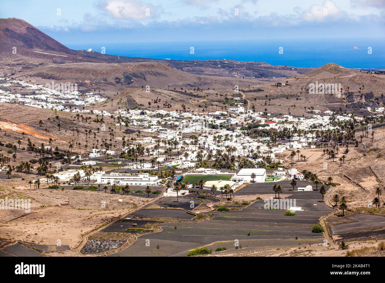 Small town of Haria in Lanzarote with palms in volcanic area Stock ...