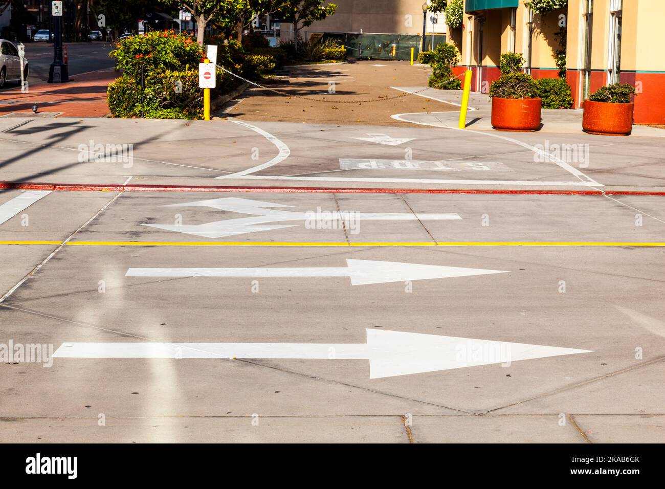 arrows and lines on the asphalt to indicate the direction of driving ...