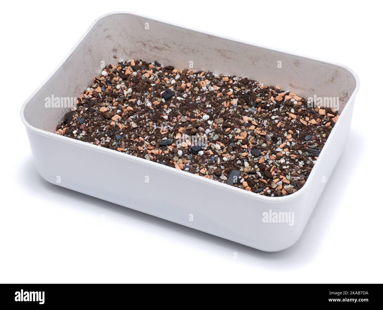 plastic box with substrate soil for transplanting houseplants isolated ...