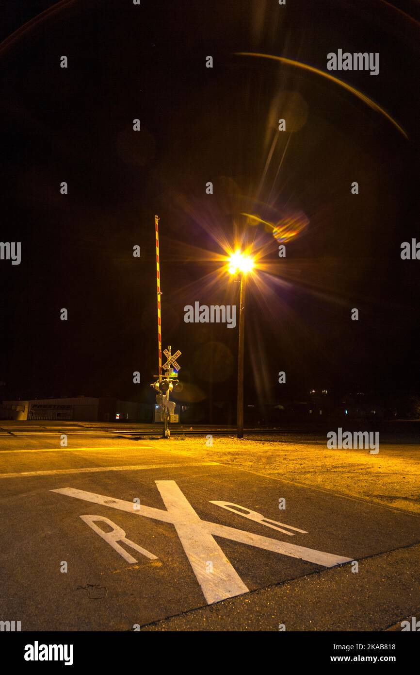 train crossing by night in Kingman Stock Photo - Alamy