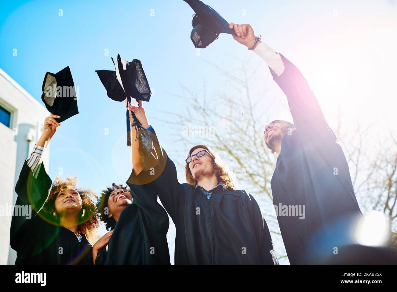 We can finally let loose now. a group of students throwing their caps ...