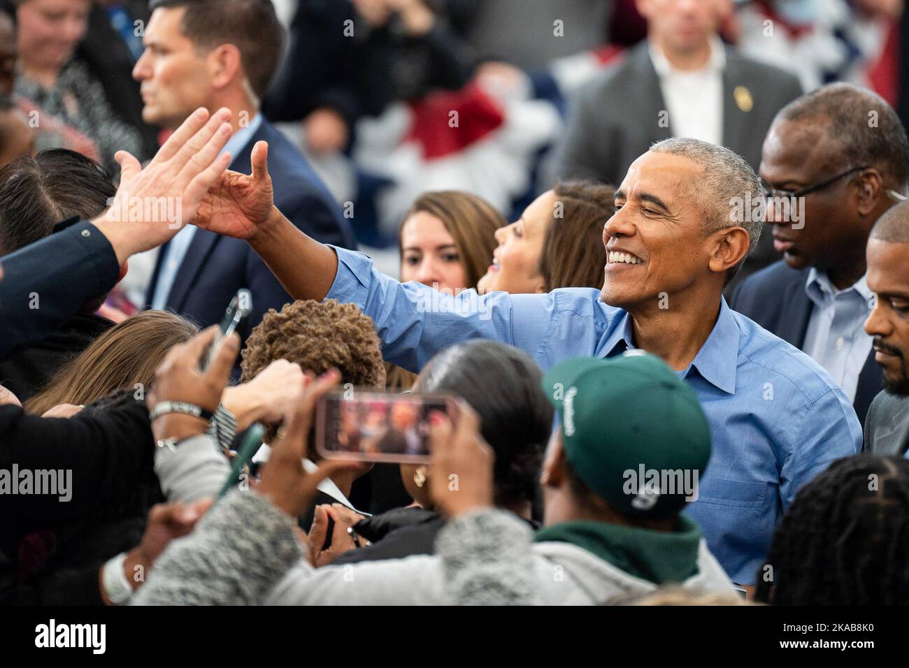 President Barack Obama interacts with supporters at the rally. Michigan ...