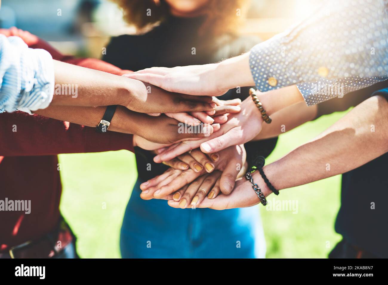 All for one. an unrecognizable group of college friends standing ...