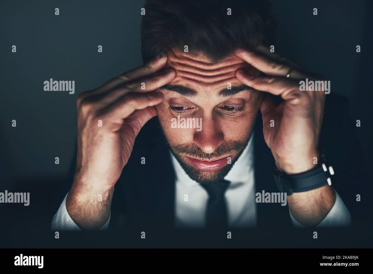 The stress is getting to him. a young businessman looking stressed ...