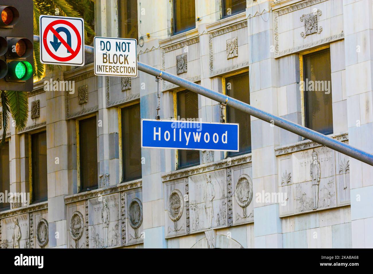 Hollywood Blvd street sign with tall palm trees Stock Photo - Alamy