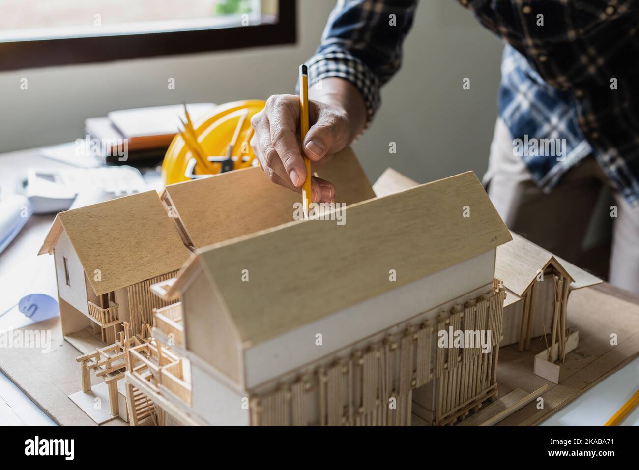 Architect man working with blueprints for architectural plan, engineer ...