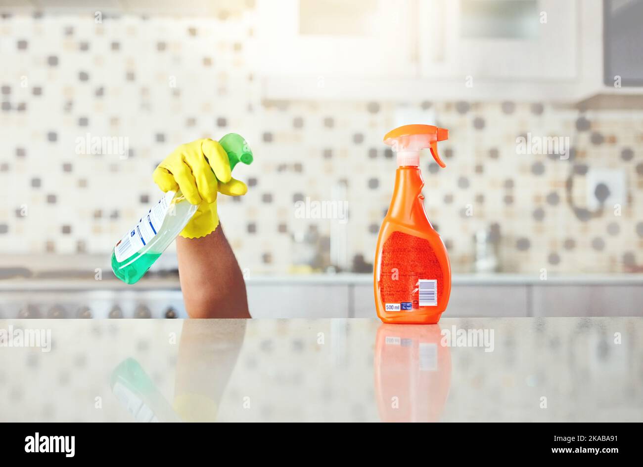 Taking cover from germs. an unrecognizable young man cleaning his home ...