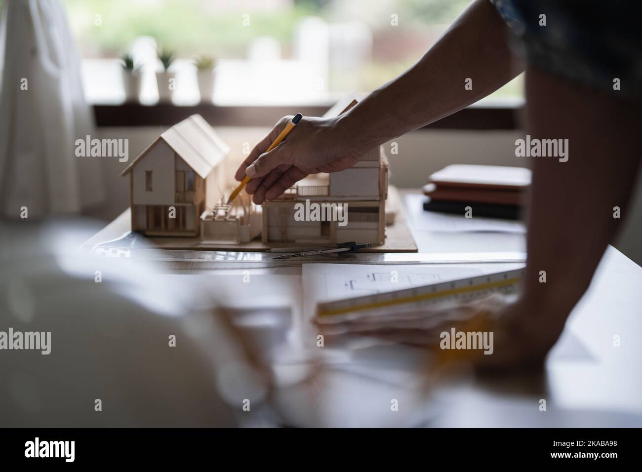 Architect man working with blueprints for architectural plan, engineer ...