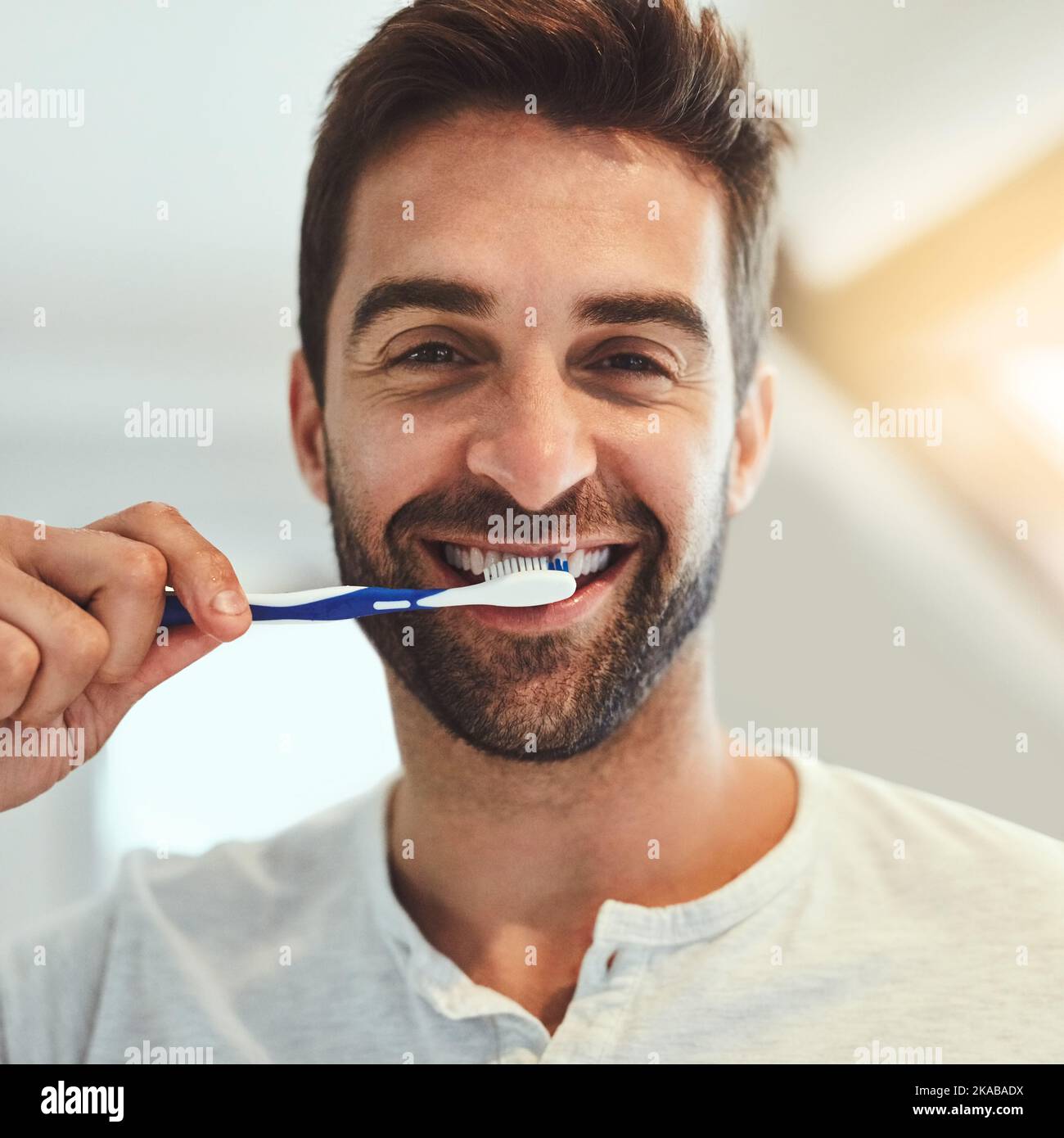 Keeping them pearly whites shinin. Cropped portrait of a handsome young ...