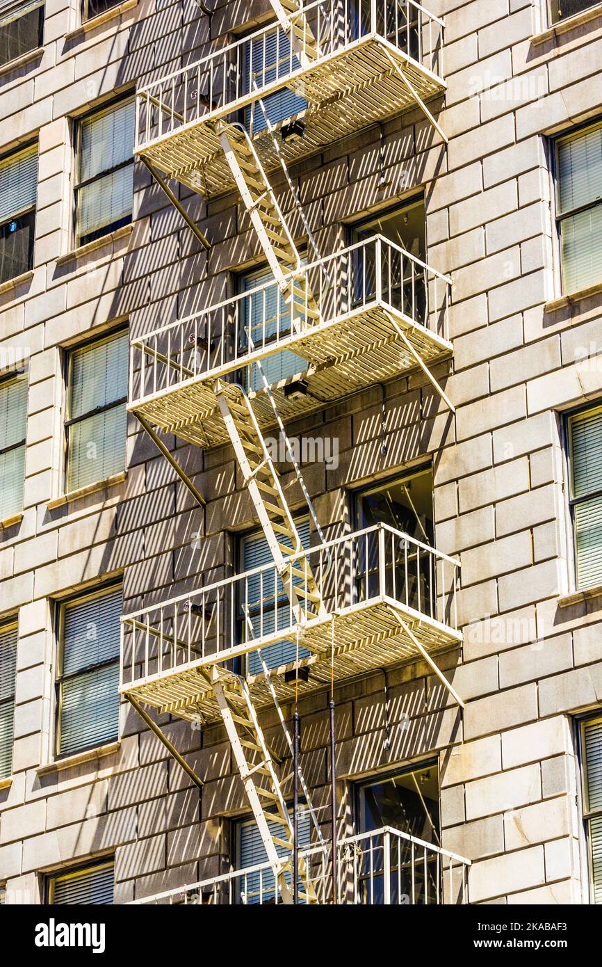 facade of historic skyscraper downtown Los Angeles with fire escape ...