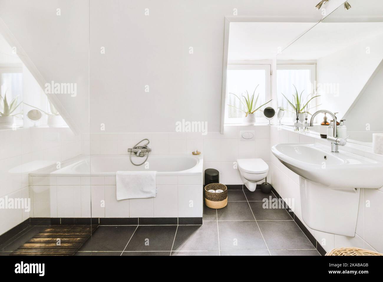 Modern home interior design of white bathroom with open bathtub and ...