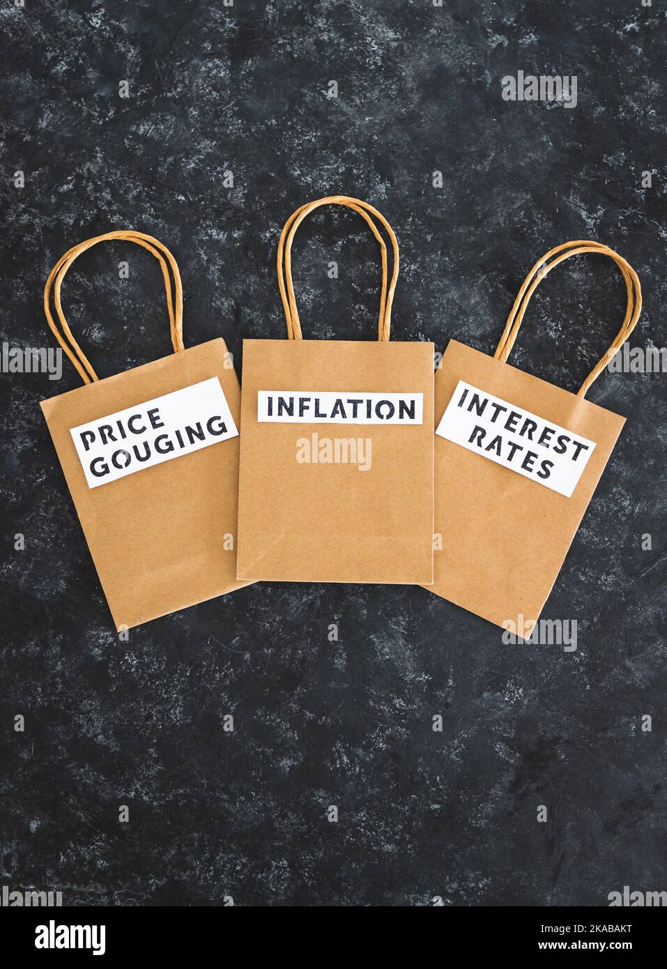 Inflation Interest Rates and Price Gouging texts on paper shopping bags ...
