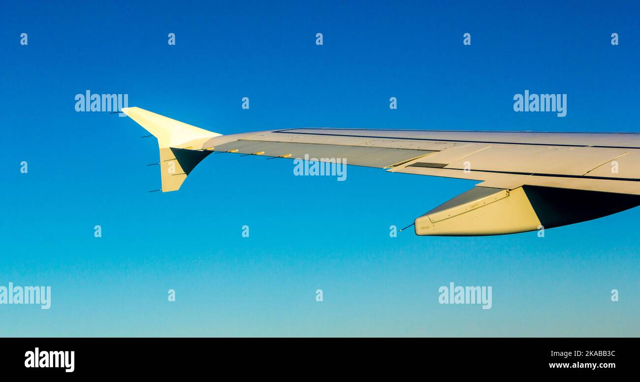 Aircraft wing some component of plane on during flying high above sky ...