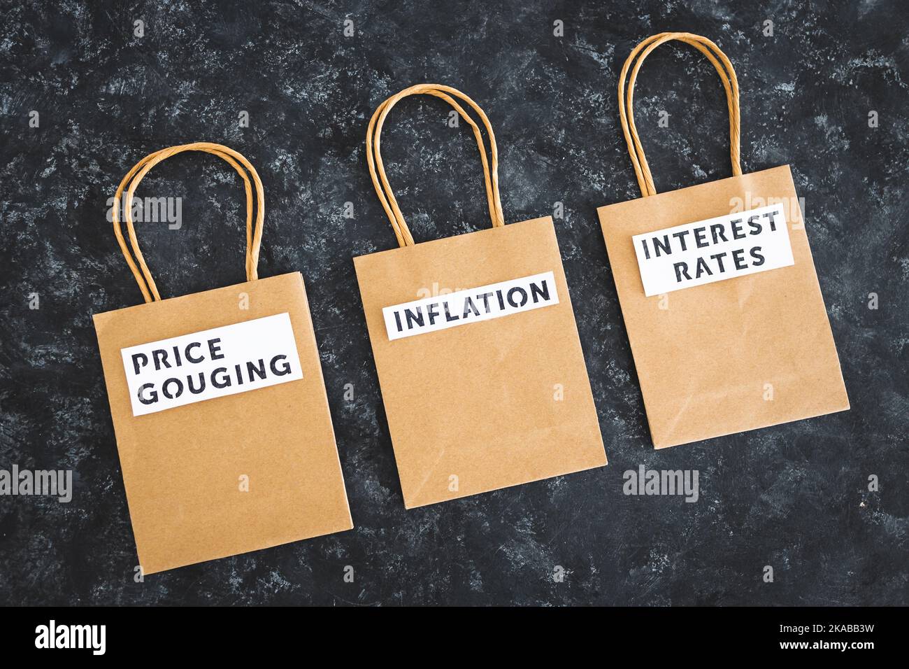 Inflation Interest Rates and Price Gouging texts on paper shopping bags ...