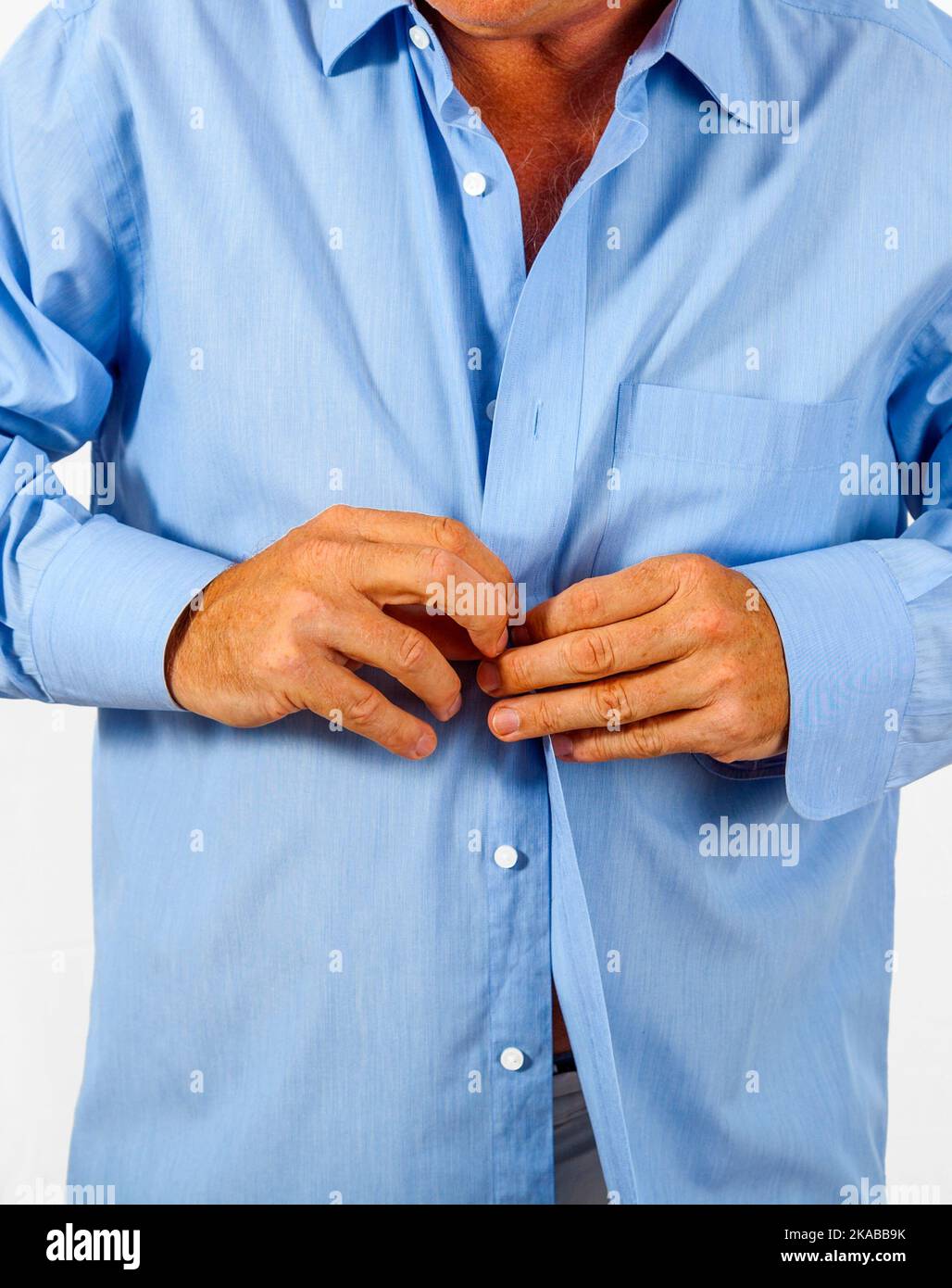 Husband buttoning shirt hi-res stock photography and images - Alamy