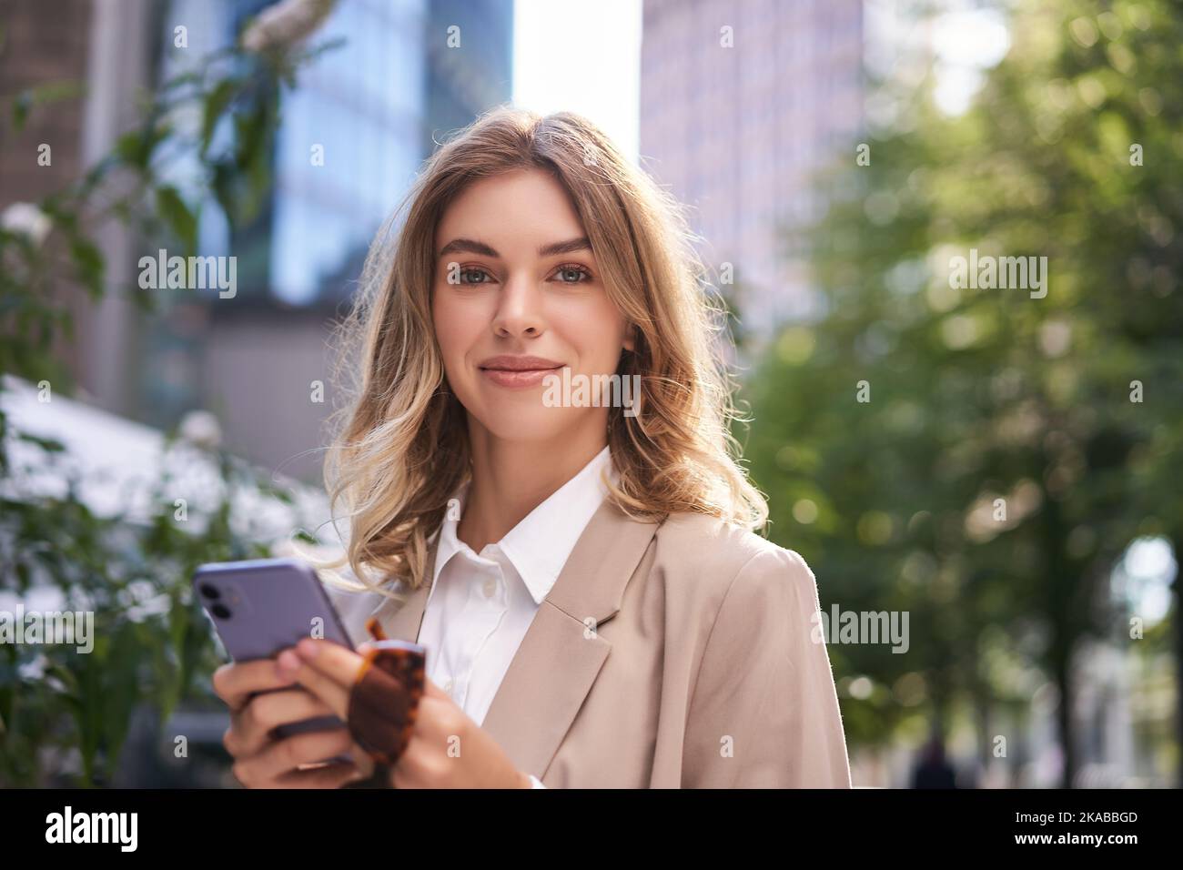 Close up portrait of corporate woman, young intern walks on street to ...