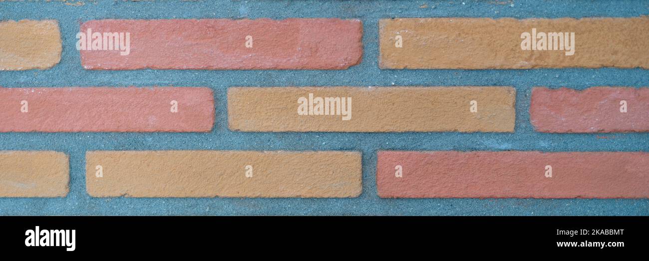 Stone wall made of rectangular bricks closeup Stock Photo - Alamy