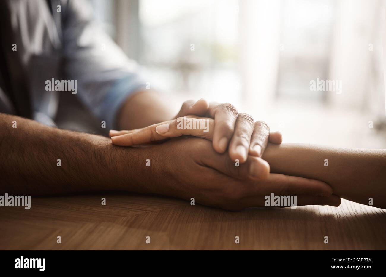 Well get through this together. two unrecognizable people holding hands ...