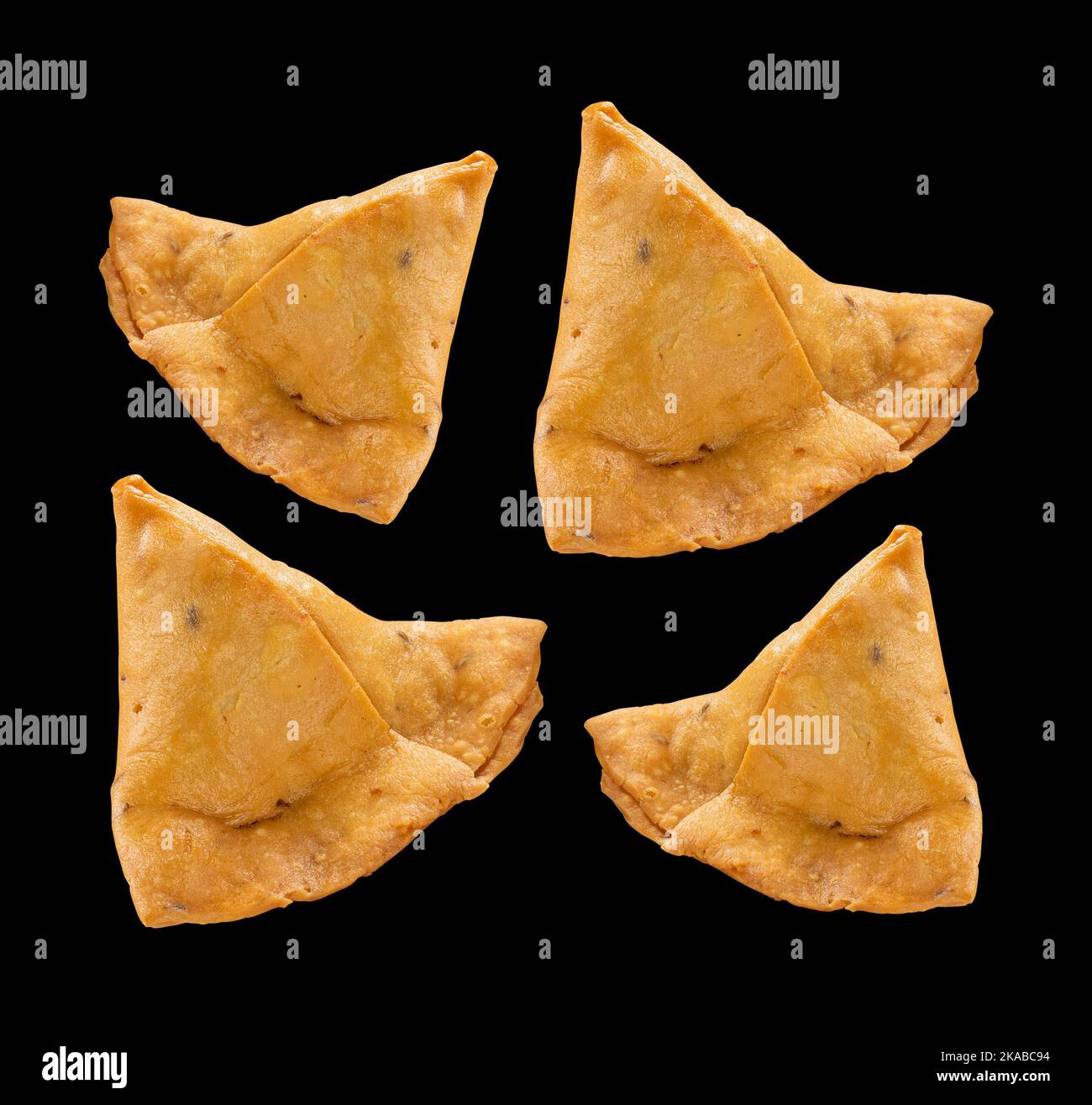 4 samosas with meat and vegetables isolated on Black background ...