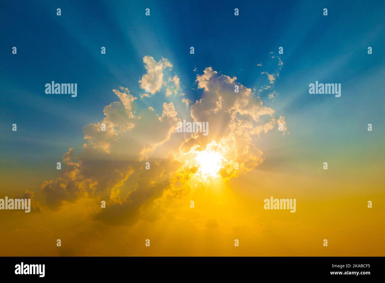 Sunset with sun rays Stock Photo - Alamy
