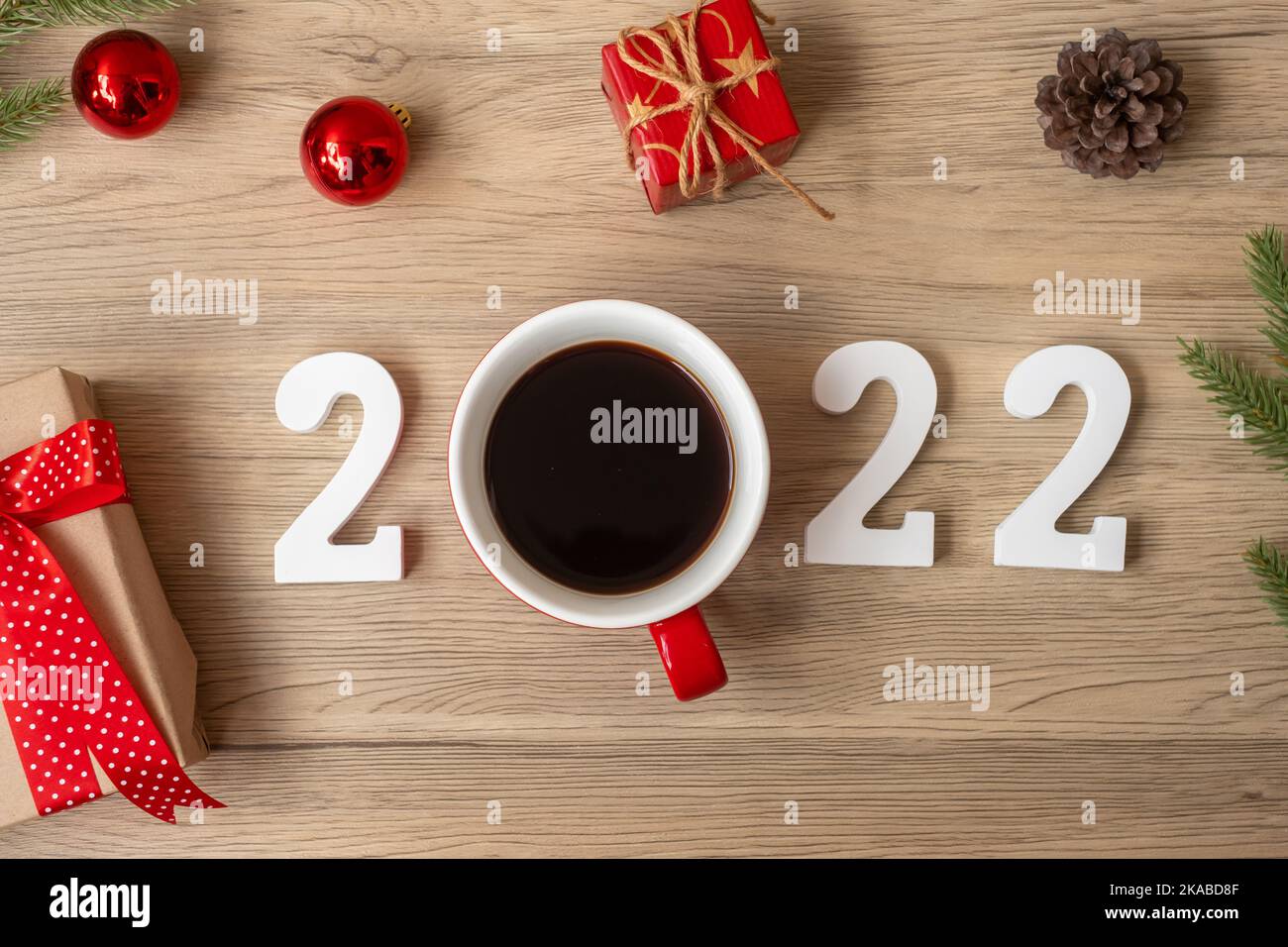 2022 Happy New Year with coffee cup and Christmas decoration on wood ...