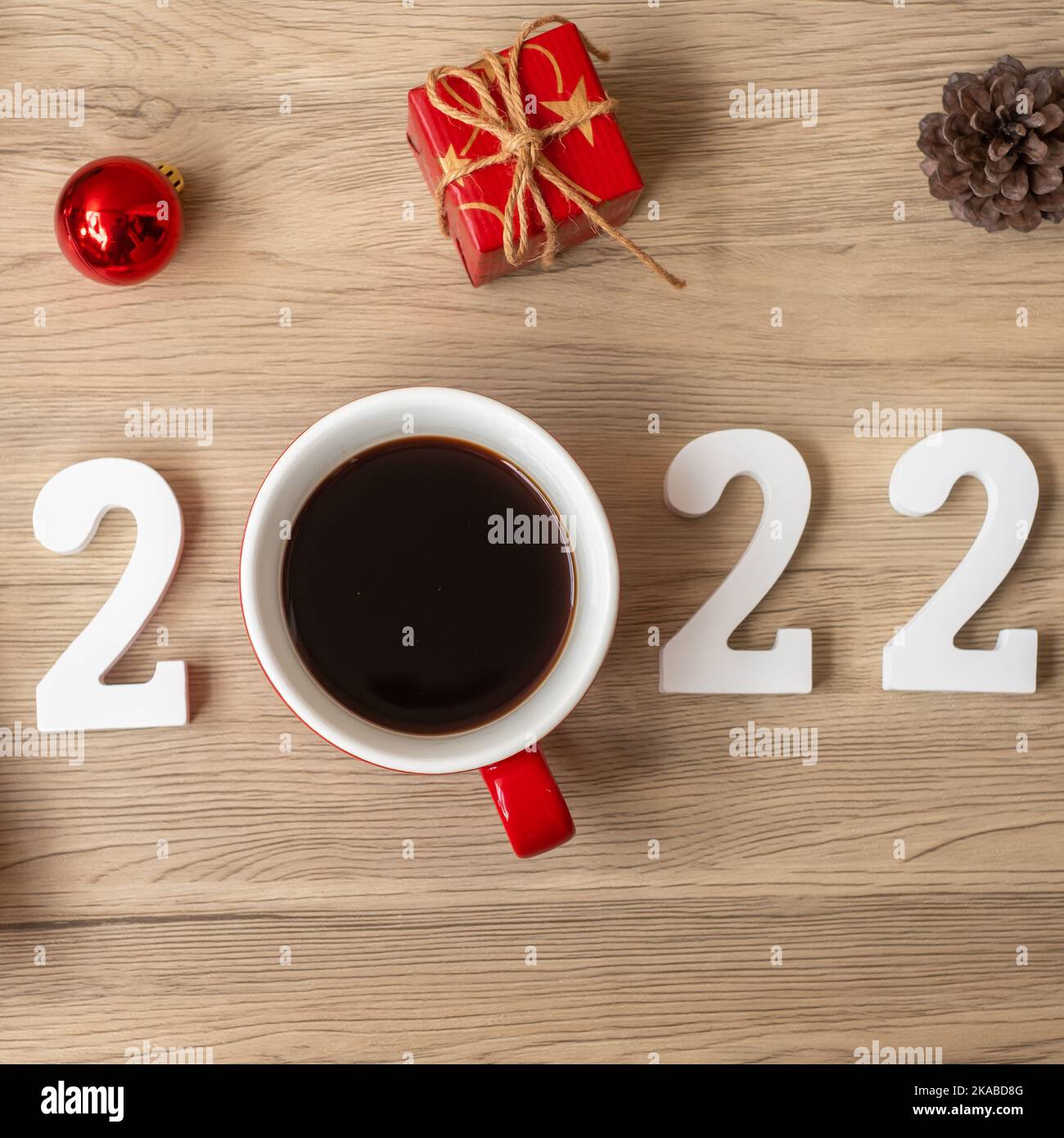 2022 Happy New Year with coffee cup and Christmas decoration on wood ...