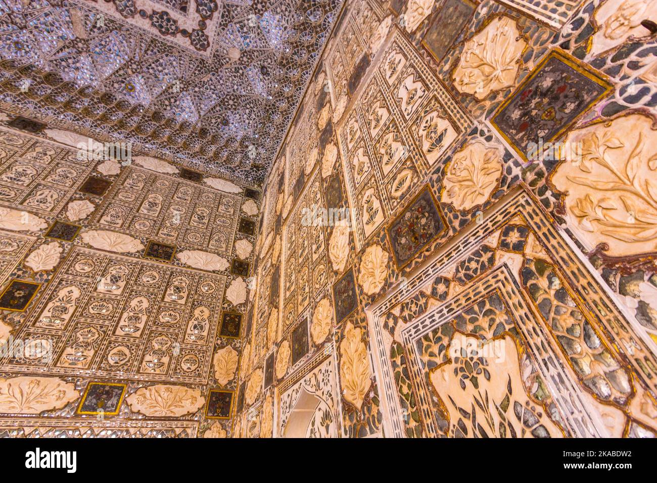 details of walls with silver and mirrors in rich decorated Amber fort ...