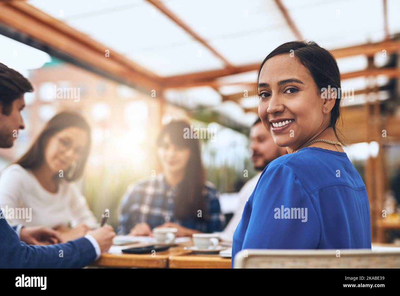 She loves the out of office staff meetings. Portrait of a cheerful ...