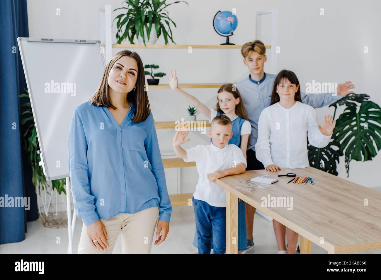 Smiling together. Group of children of different ages stand in a ...