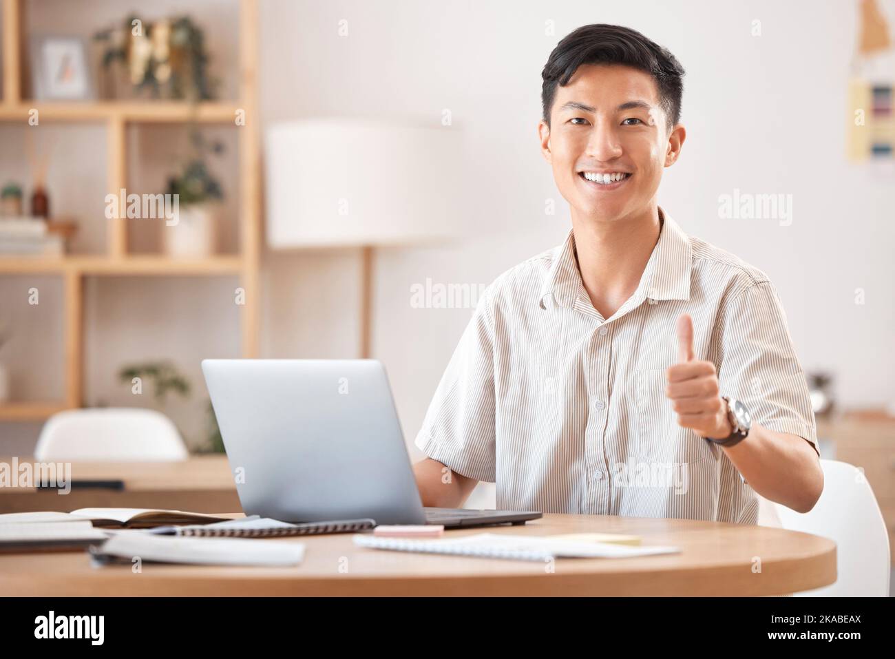 Thumbs up, laptop and portrait Asian businessman in office with hand ...