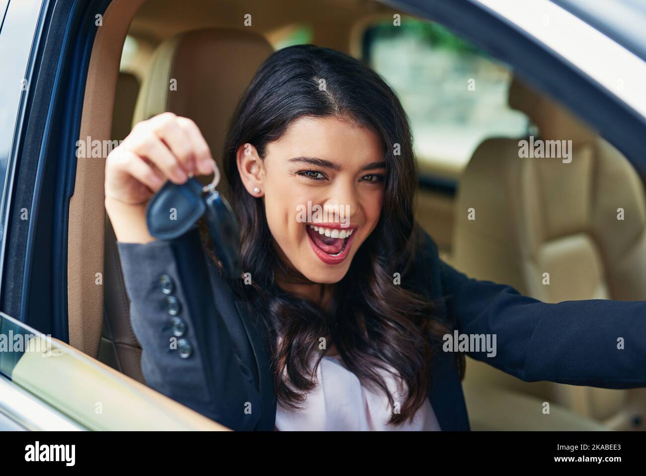 Im More Than Ecstatic About My New Car An Attractive Young Woman