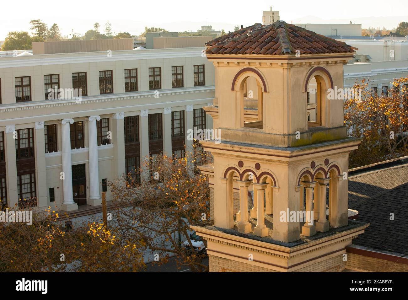 Late afternoon sun shines on the historic church and downtown of the ...