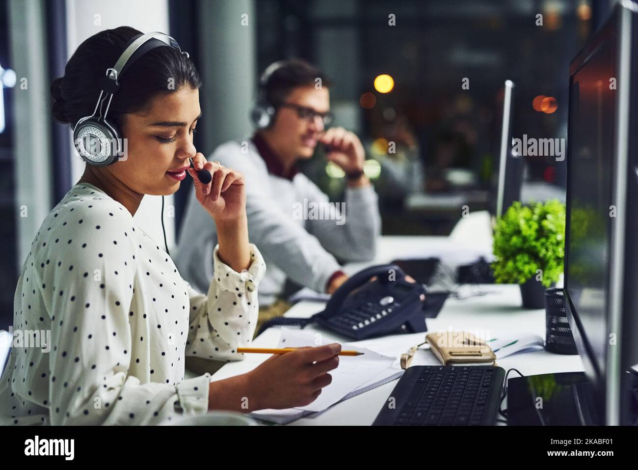 Resolving issues with speed for their clients. young call centre agents ...