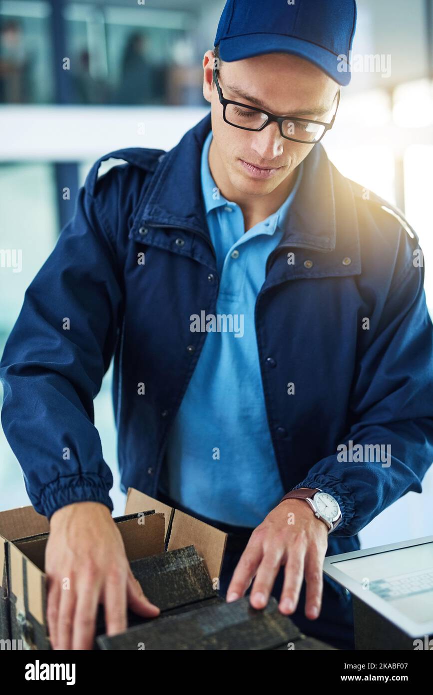 Ensuring all boxes are packaged according to quality standards. a ...