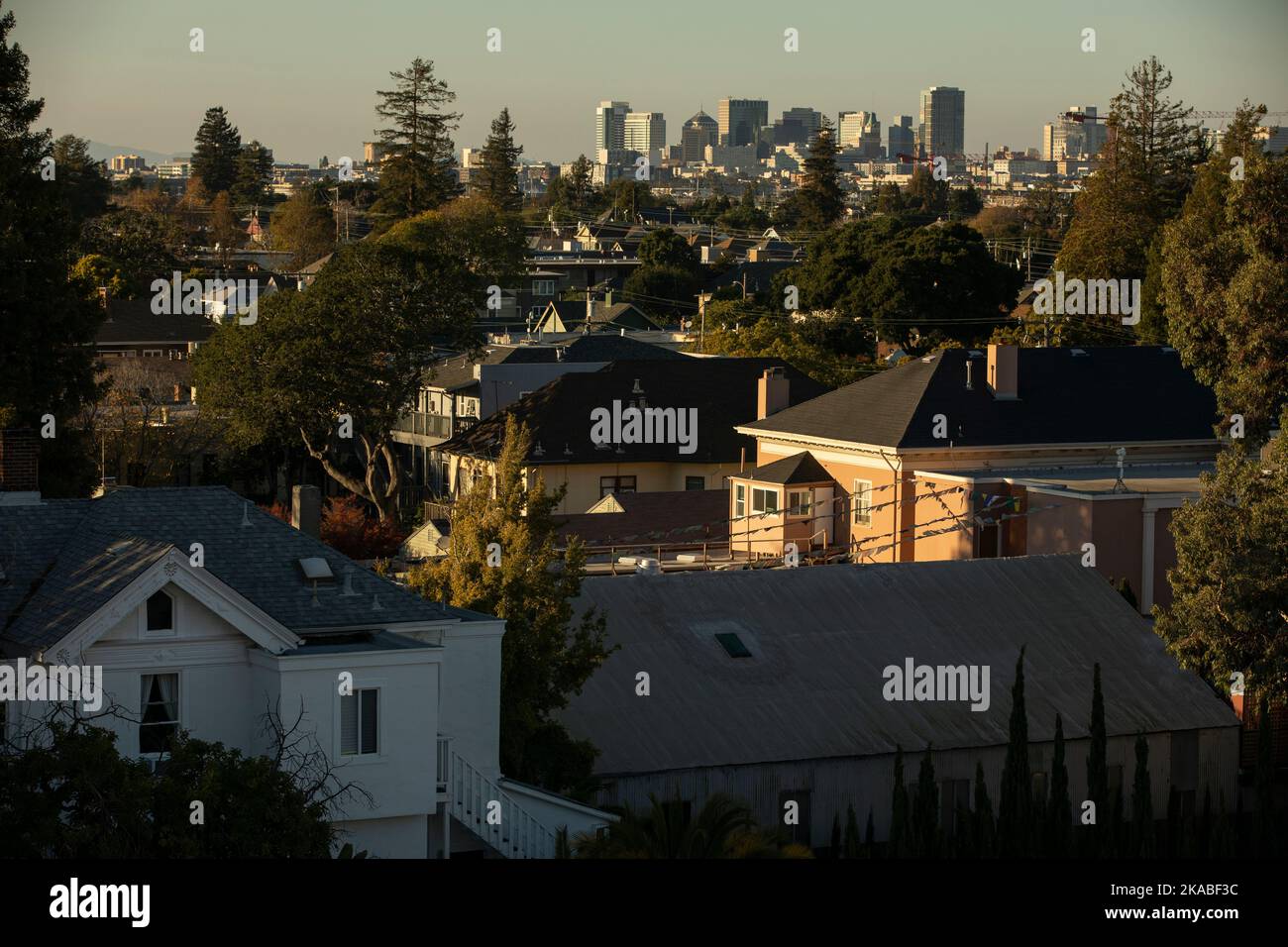 Late afternoon sun shines on the historic housing of the bay area city of downtown Alameda ...