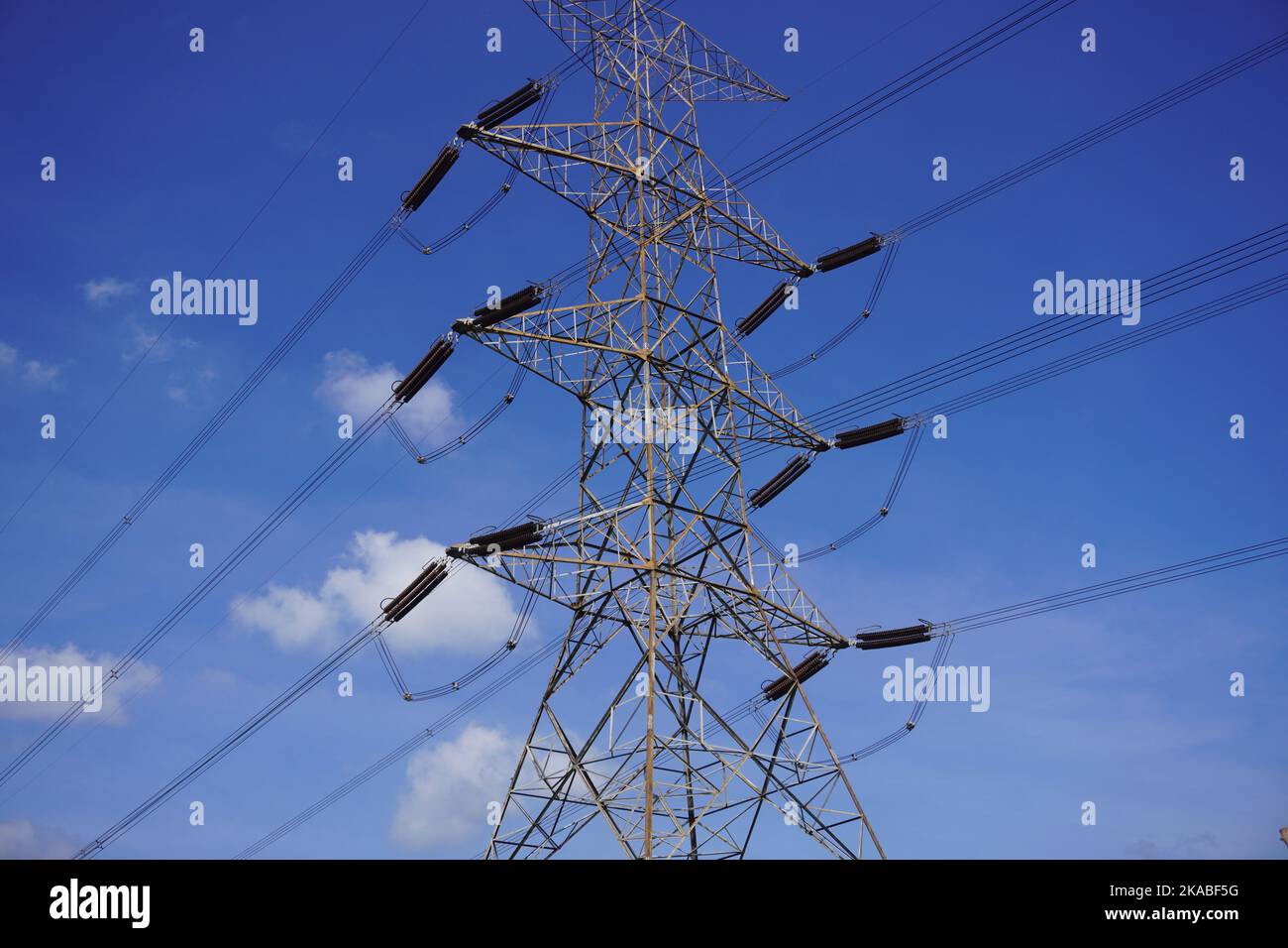 high-voltage power pole with a bright blue sky background Stock Photo ...
