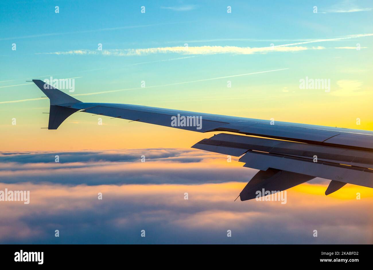 wings of aircraft in sunrise Stock Photo - Alamy