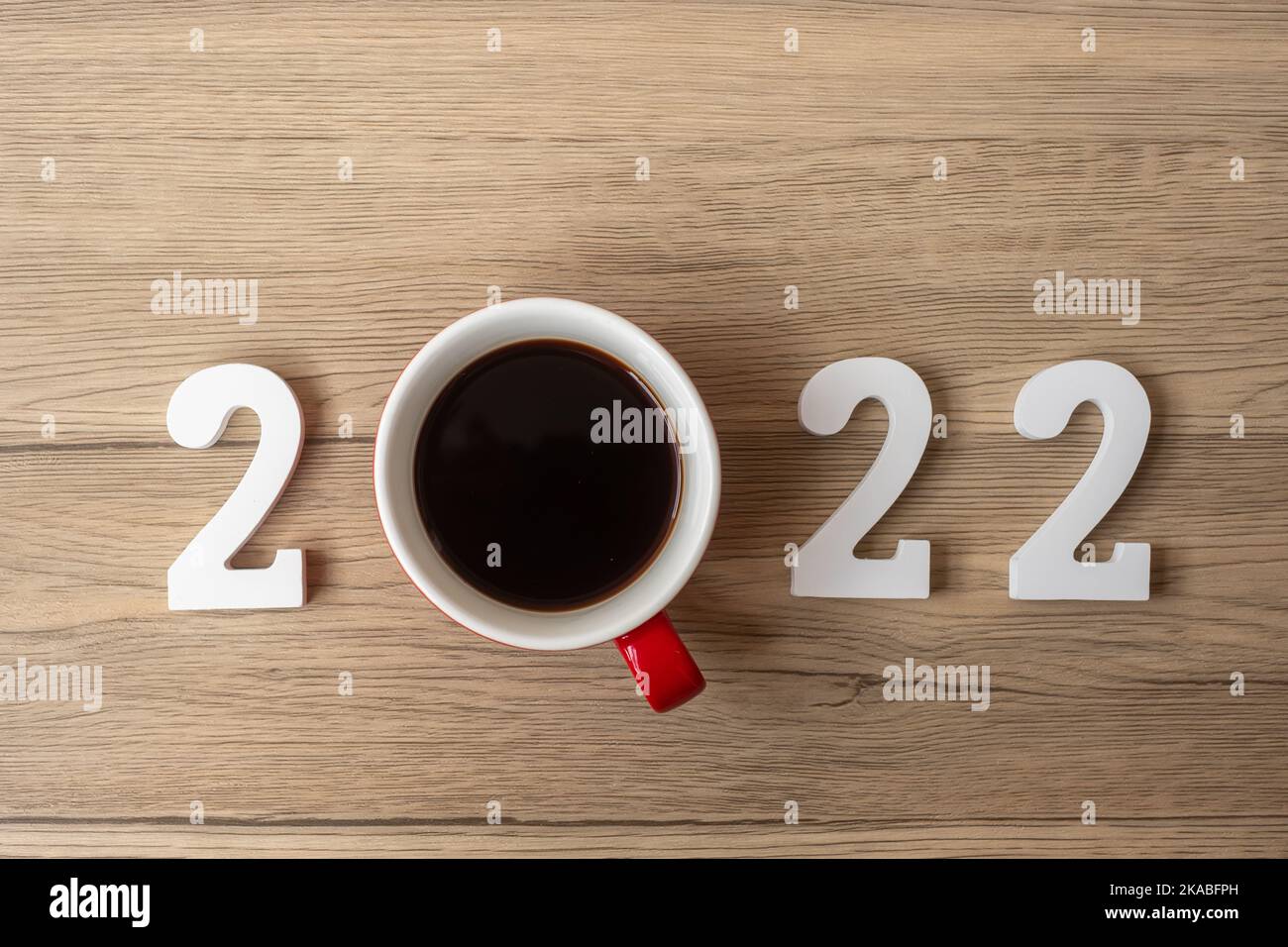 2022 Happy New Year with coffee cup and Christmas decoration on wood ...