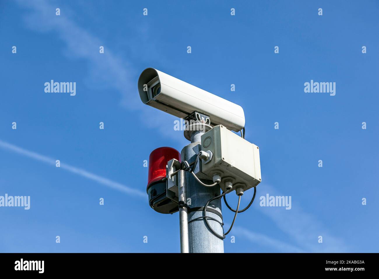 CCTV security camera under blue sky Stock Photo - Alamy